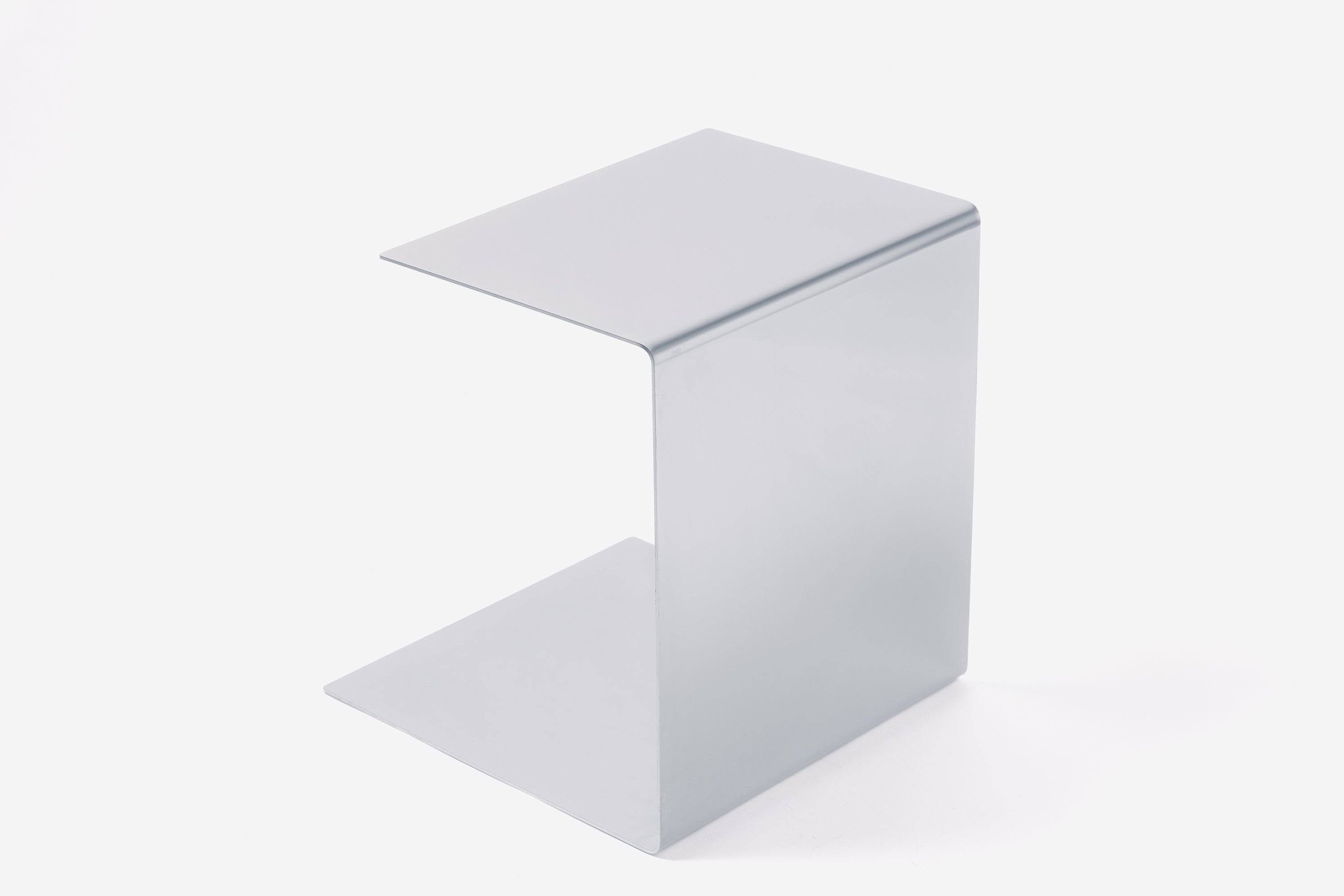 Polished steel side table– B E N T